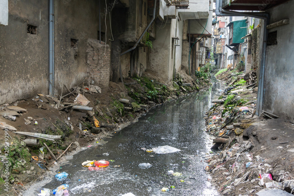 Dirty polluted waste water in big city with garbages. Environment ...