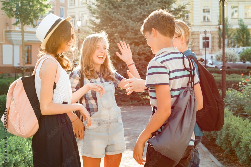 Meeting smiling friends teenagers in the city, happy young people ...