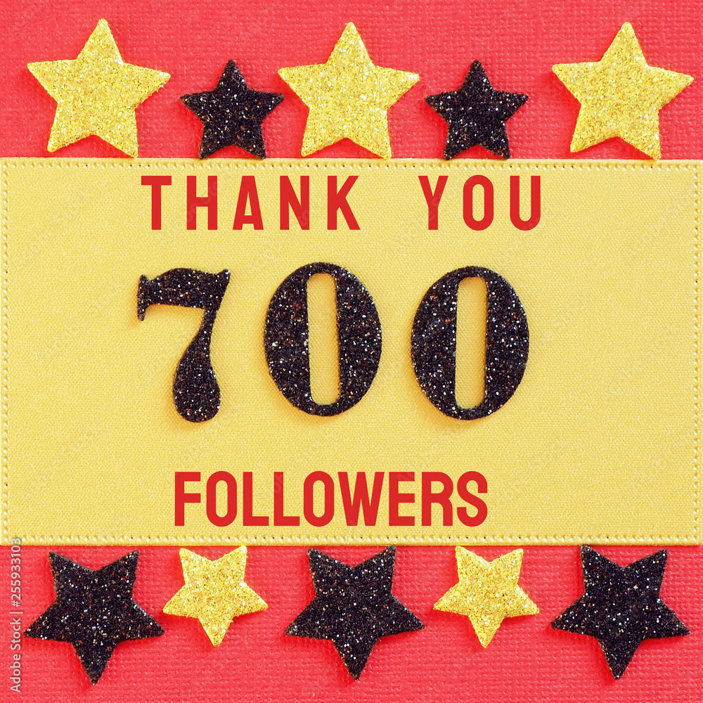 Thanks 700 followers. message with black shiny numbers on red and gold ...