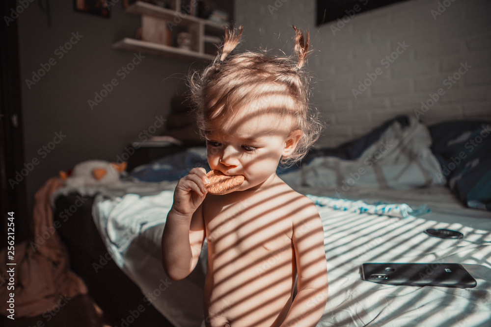 child with tails on his head favors morning in bed in his parents' room ...