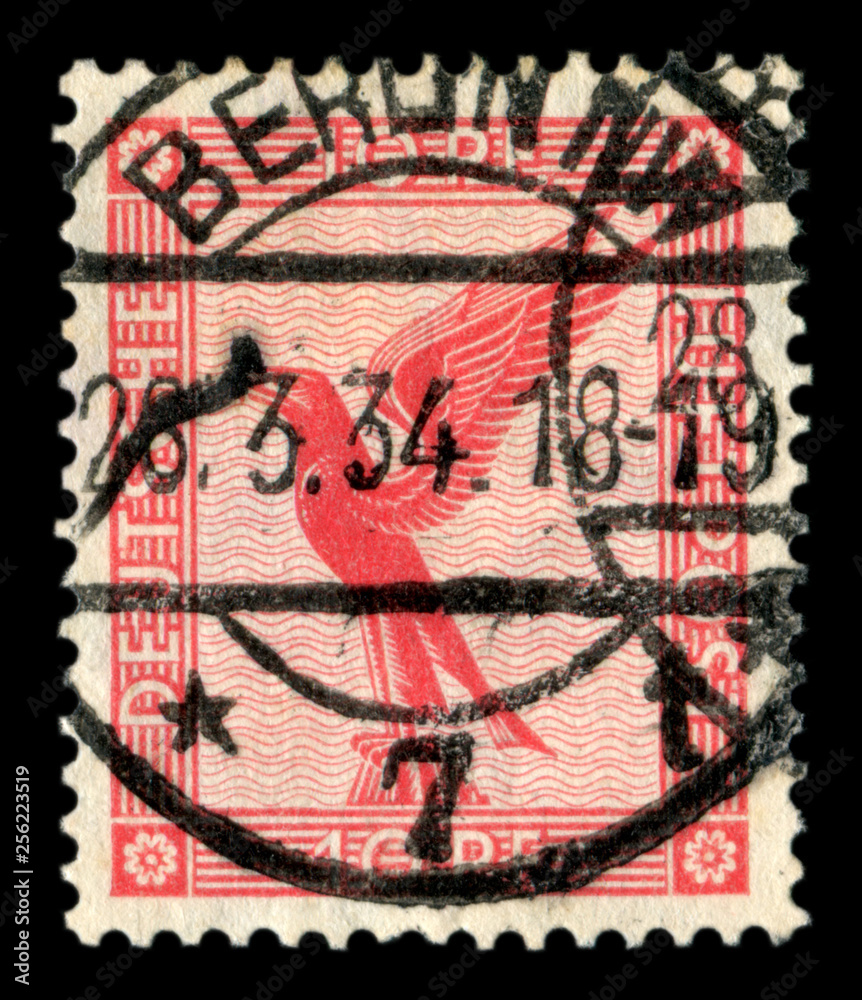 GERMANY - 28 March 1934: German historical stamp: The Falcon spread its ...
