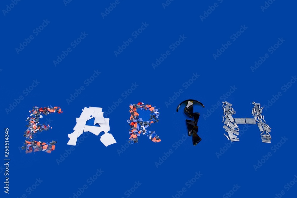 EARTH.Crushed plastic, pieces of torn paper,ALUMINUM PIECES AND broken ...