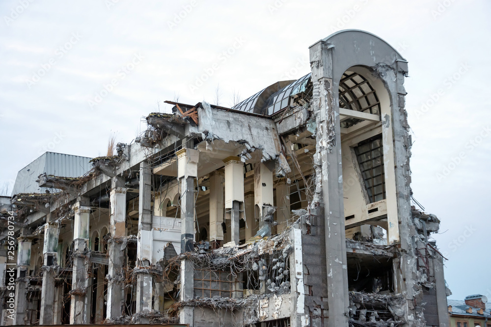 Destroyed building after demolition, man-made accident. The supporting ...