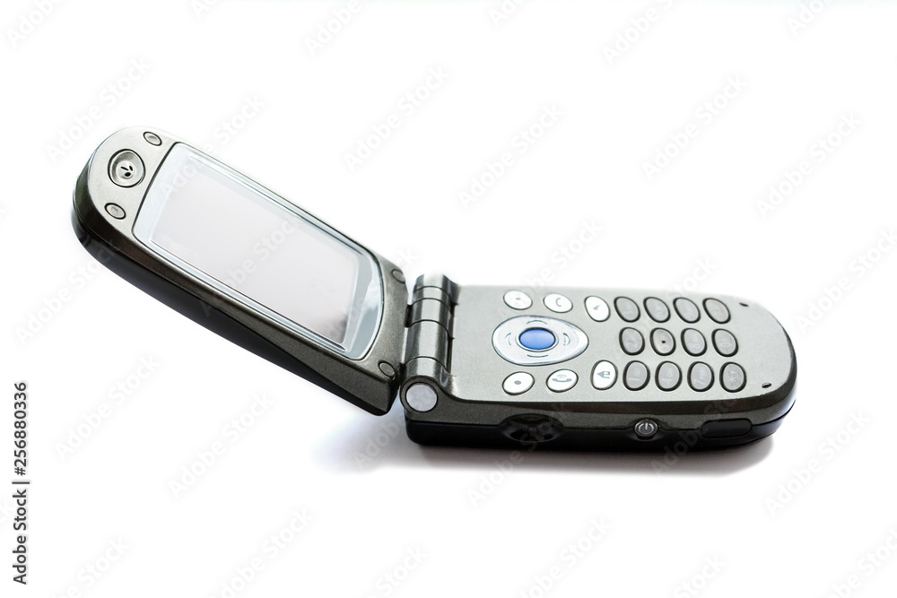 Black folding push-button old mobile phone on a white background. GSM ...