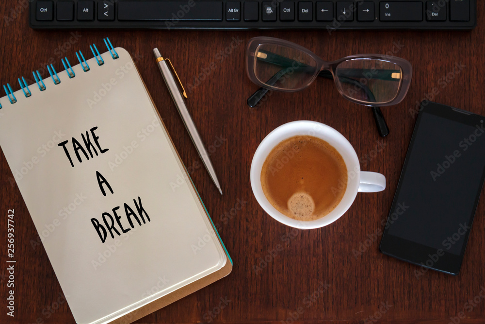 Desk with office accessories and Take a Break message. Stress ...