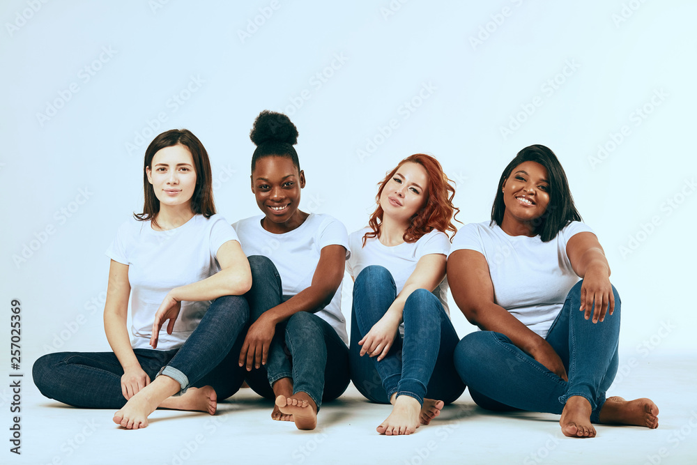 Four young multi ethnic female models of different race, body size and ...