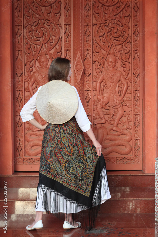 Tourist girl in Pavlovo Posad shawl and Wat Sila Ngu (Red Temple) on ...