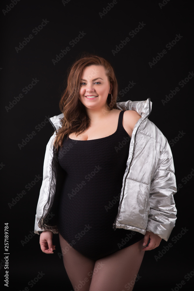 Beautiful young woman plus size with big bust in underwear and down ...