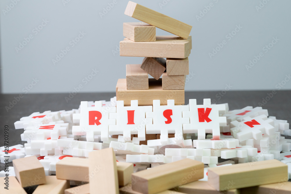 Risk management concept, white puzzle jigsaw with alphabet building the ...