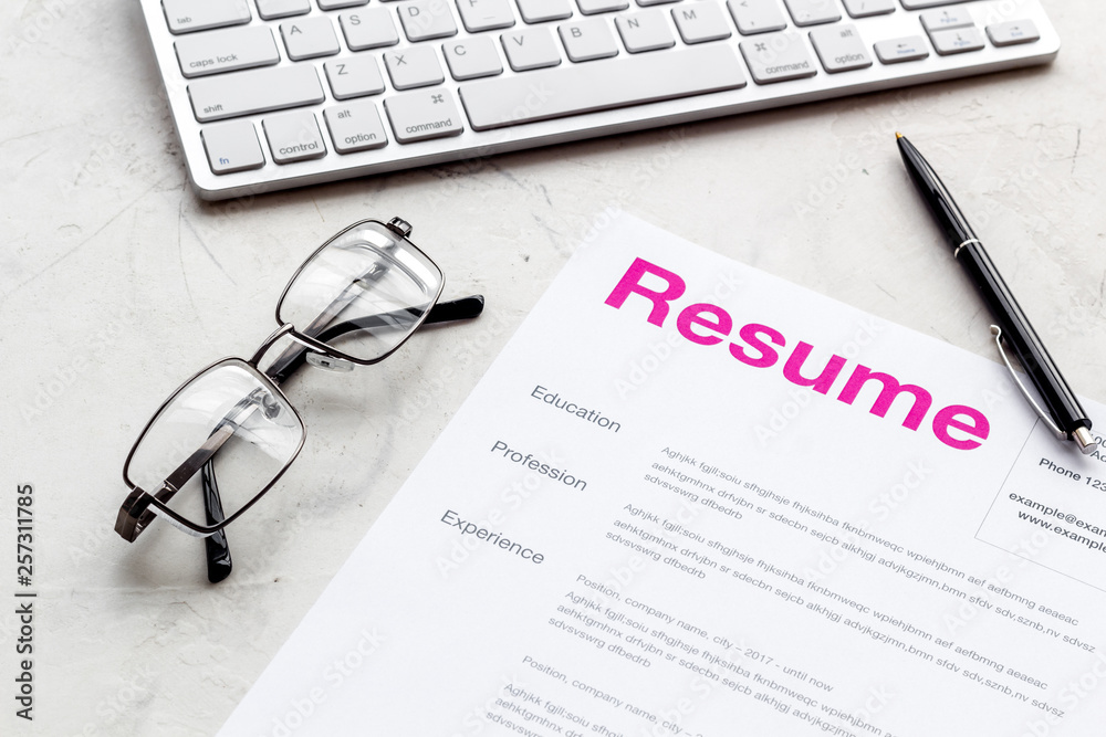 Review resumes of applicants set with keyboard and glasses white work ...