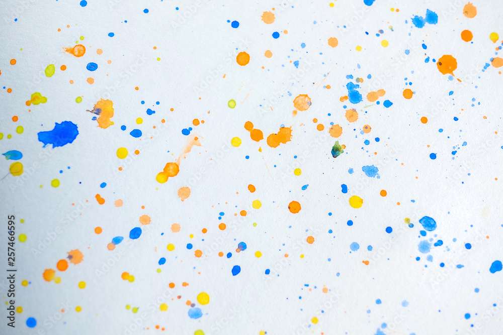 Watercolor splash background. Orange, yellow, blue colorful paint drops ...