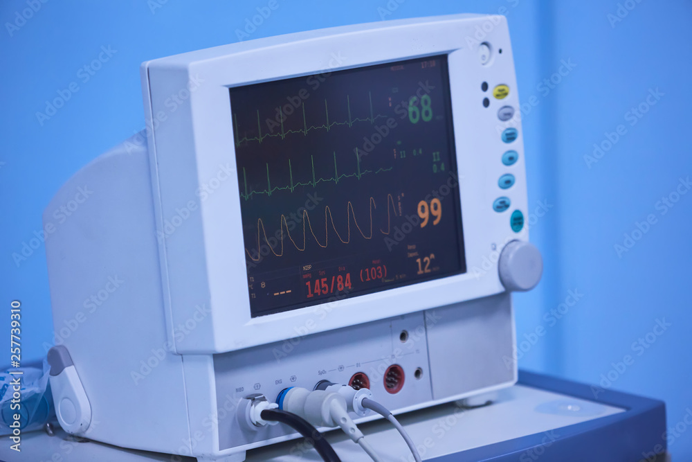An anesthesia monitor shows real time vital signs for constant patient ...