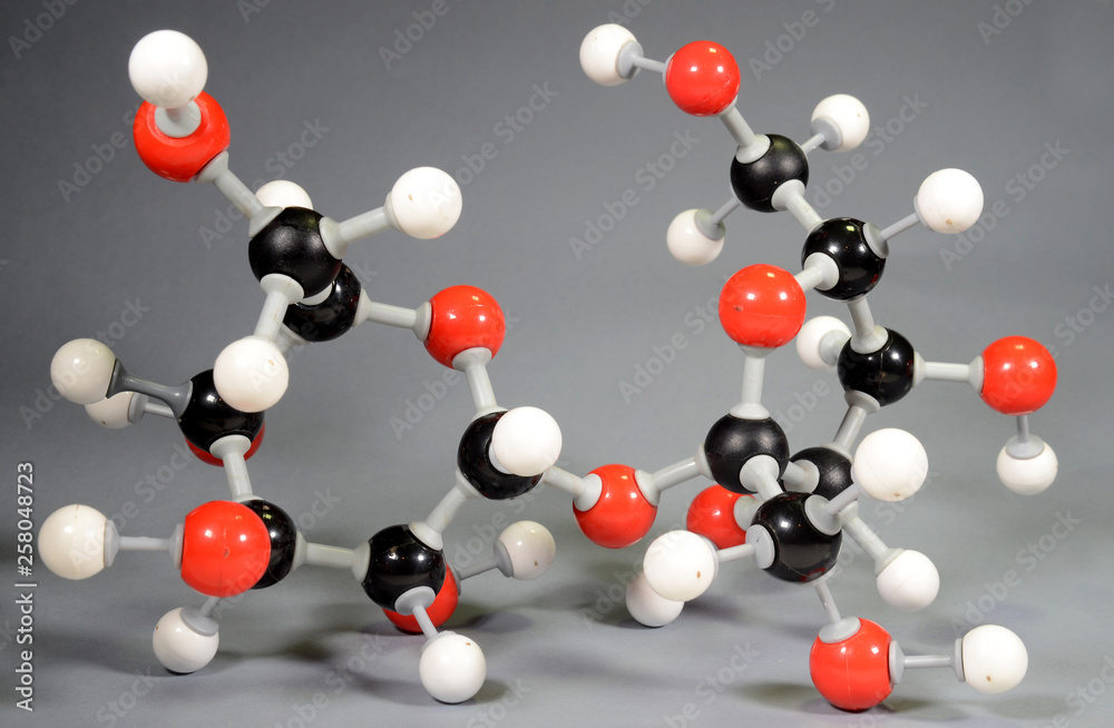 Molecule model of sugar (C12H22O11). Red is oxygen, black is carbon ...