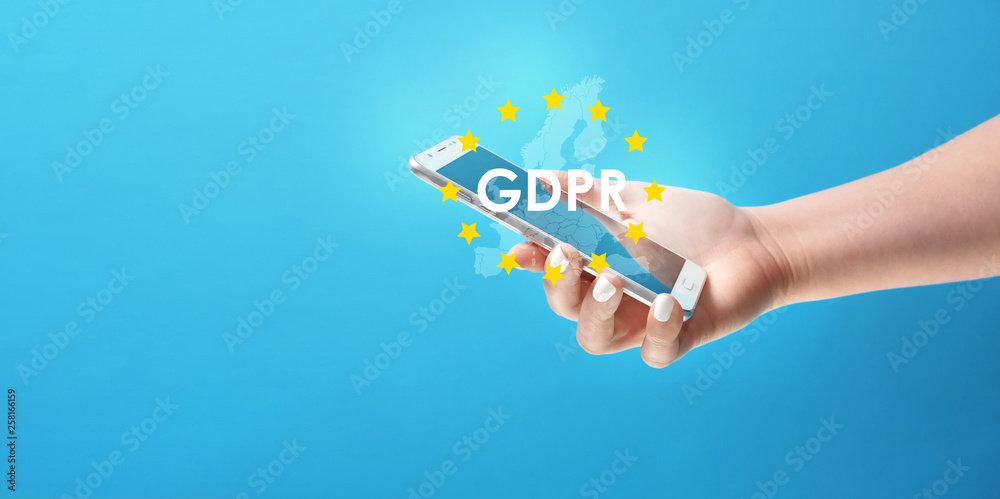 Hand holding phone with sign general data protection regulation (GDPR ...