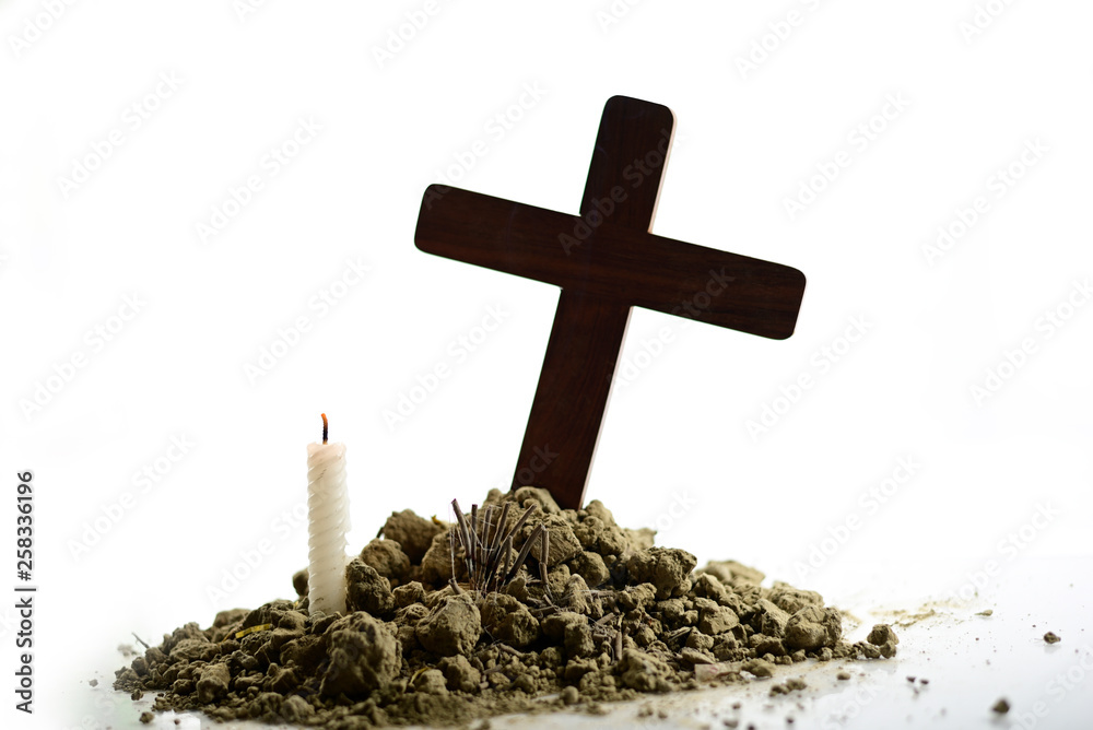 Giving respect to human soul. Give a candle and rose under Jesus cross ...