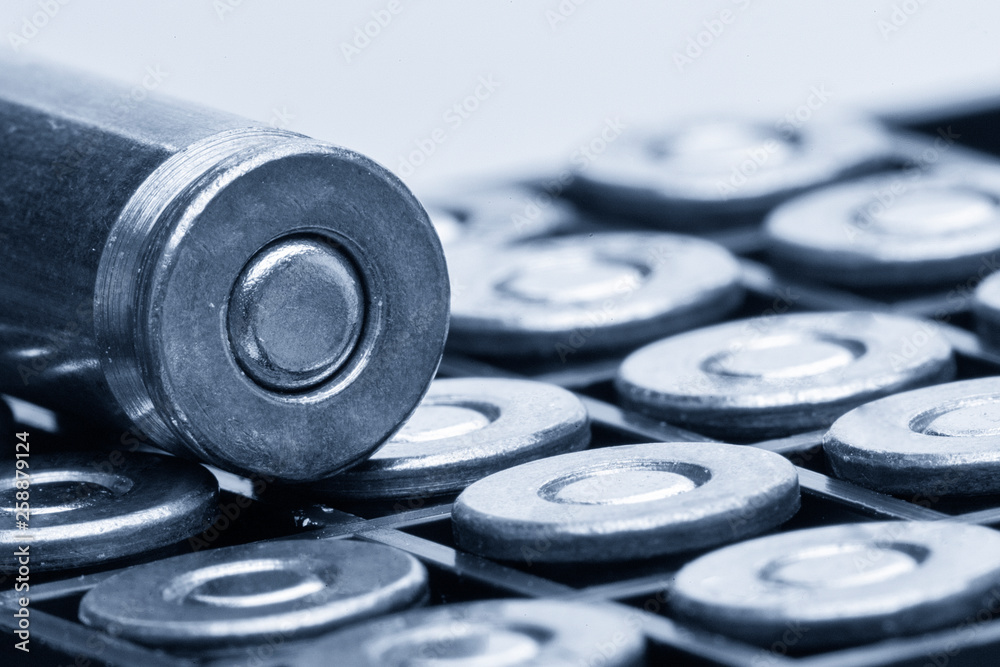 Pile of pistol bullets. The concept of limiting the spread of small ...
