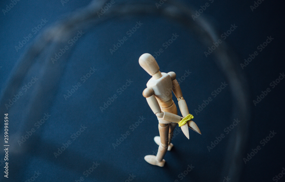 Wood man tied up with rope in emotional stress and pain, afraid ...