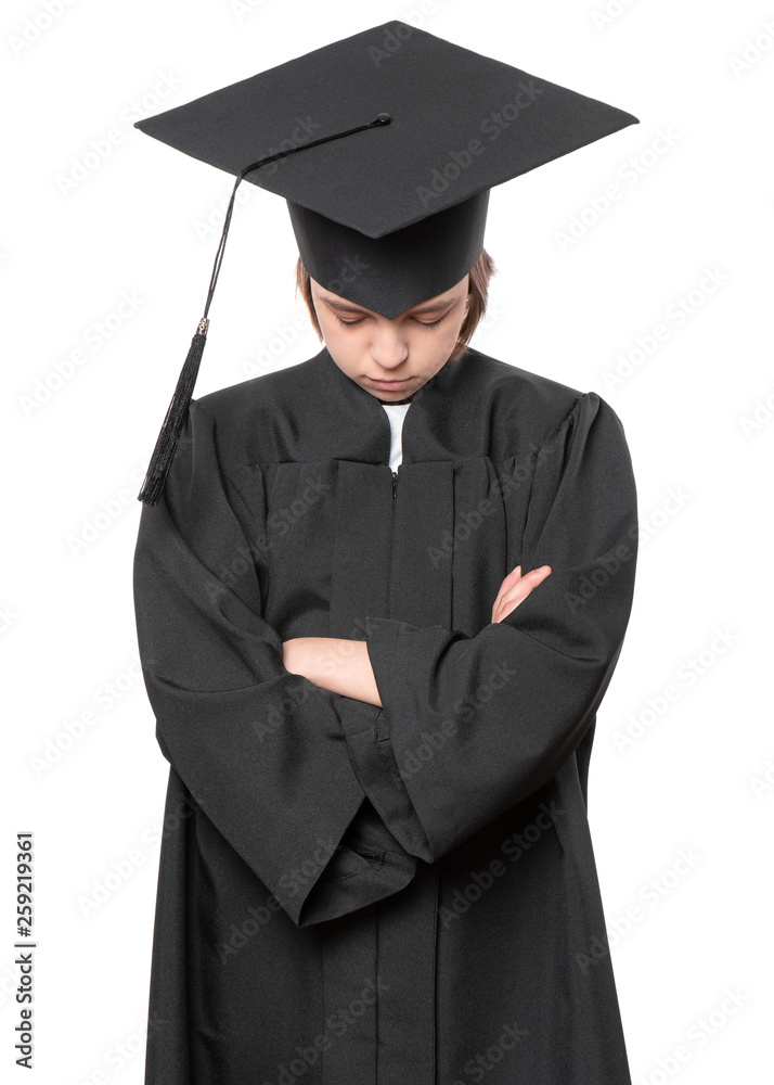 Sad disappointed graduate little girl student in black graduation gown ...