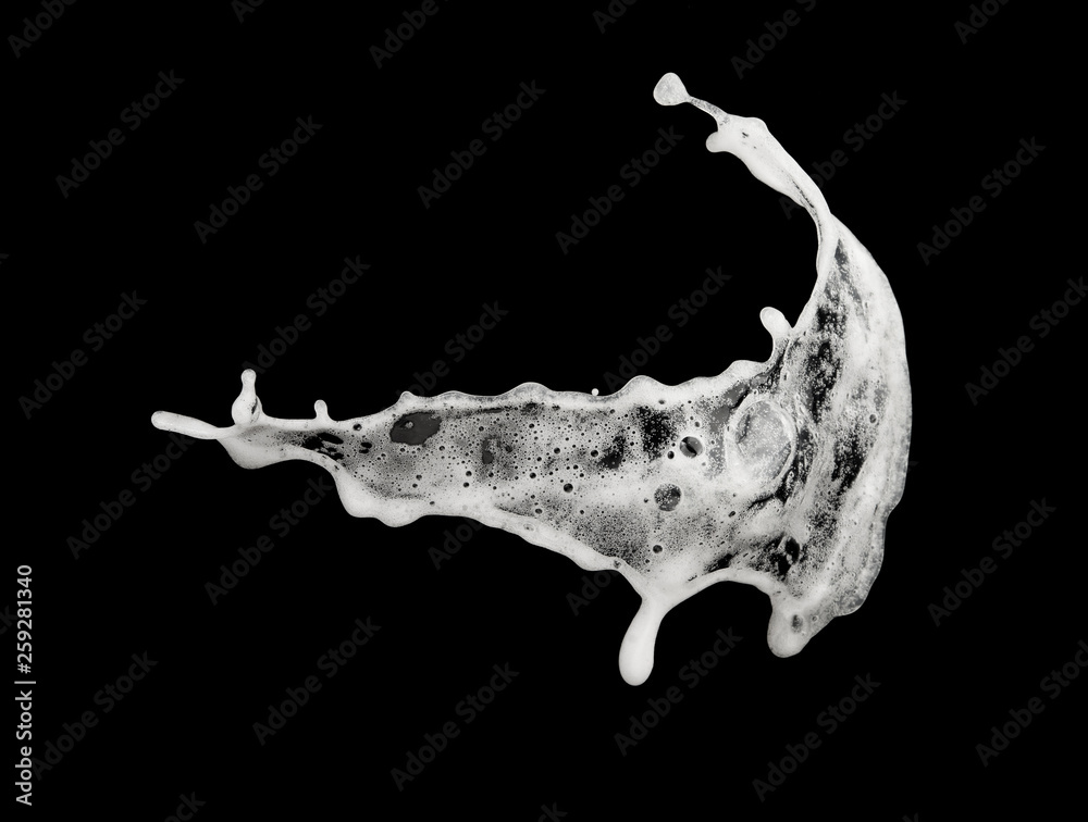 White bubble foam splash explosion in the air on black background ...