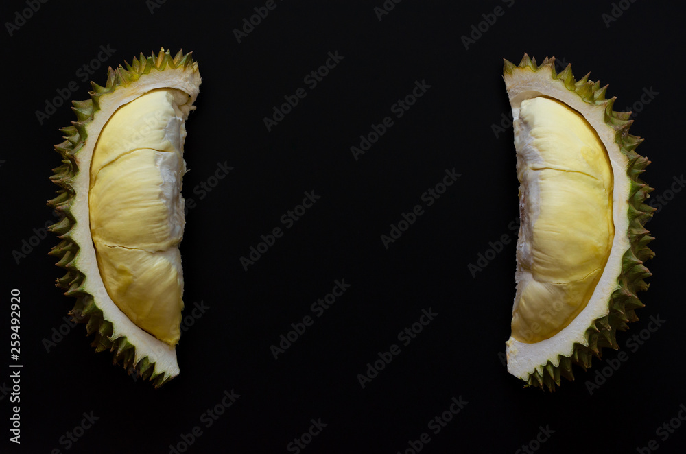 Fresh cut Durian which is king of fruit from Thailand isolated on black ...