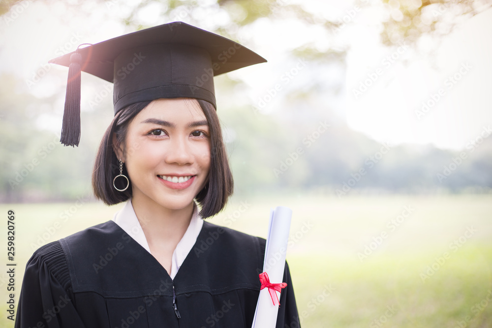 Closeup hand of graduated student holding certificate paper. Portrait ...