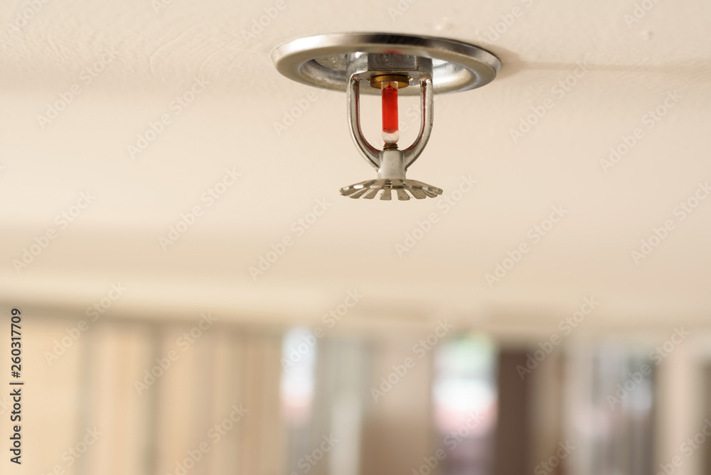 Automatic head fire sprinkler extinguisher on the white ceiling.Fire ...