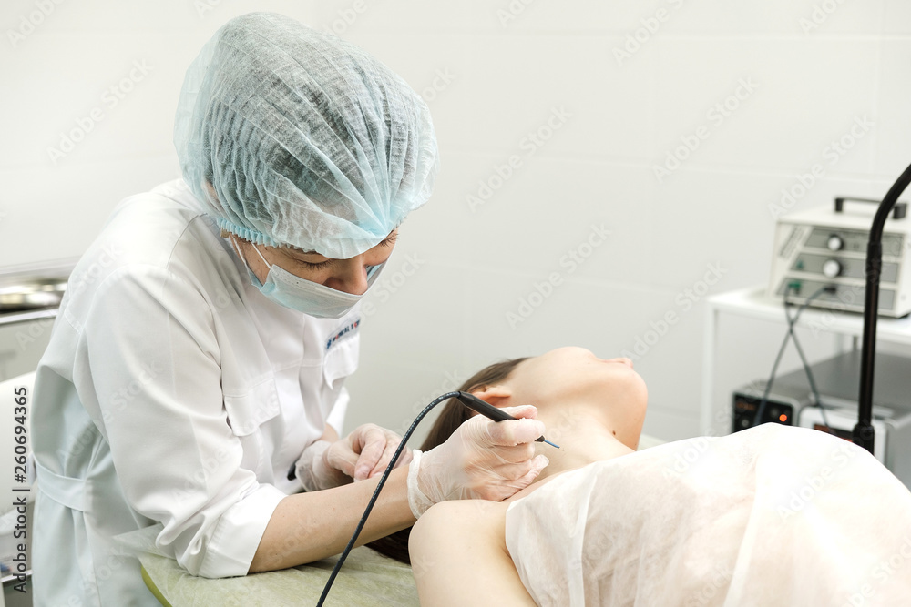Medical treatment removal of birthmark from female patient's neck ...