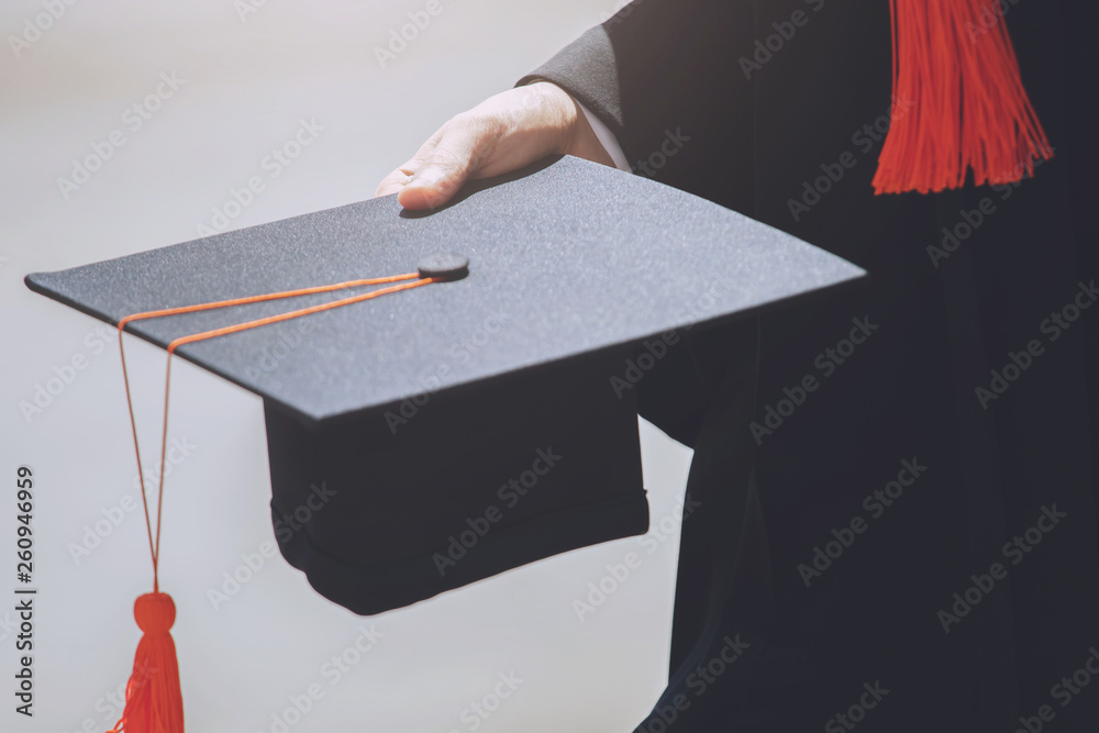 graduation,Student hold hats in hand during commencement success ...