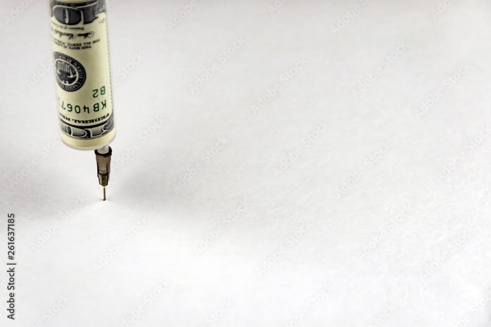 financial injections, money entry: a banknote of $ 100 inside a syringe ...