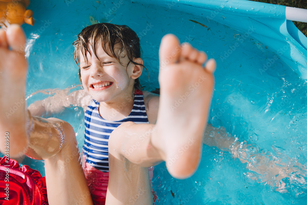 Adorable little girl having fun in children's swimming pool Stock Photo ...