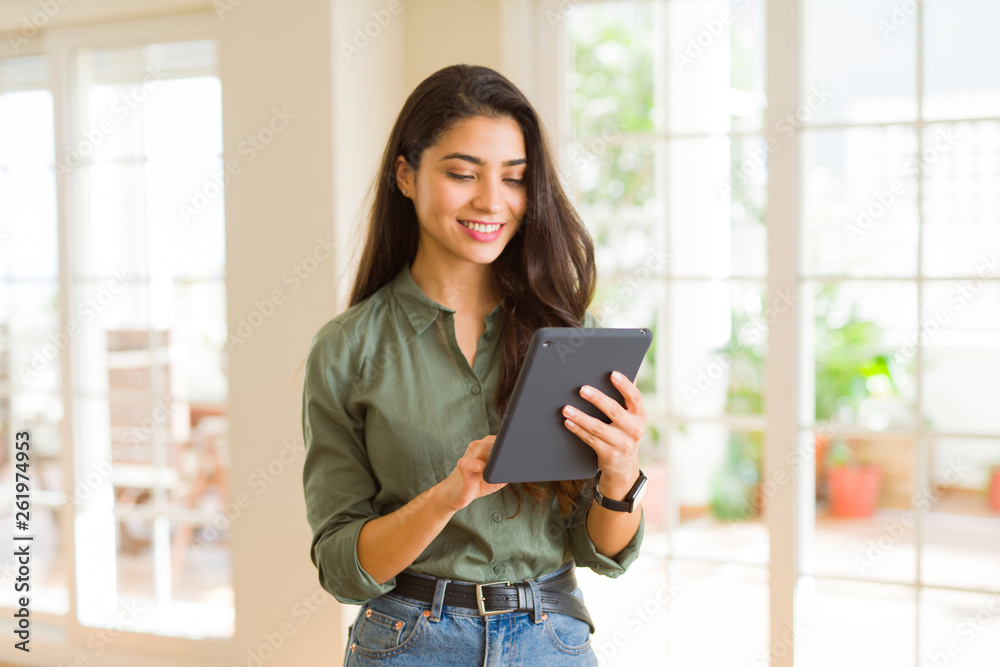 Beautiful young woman working using touchpad tablet Stock Photo | Adobe ...