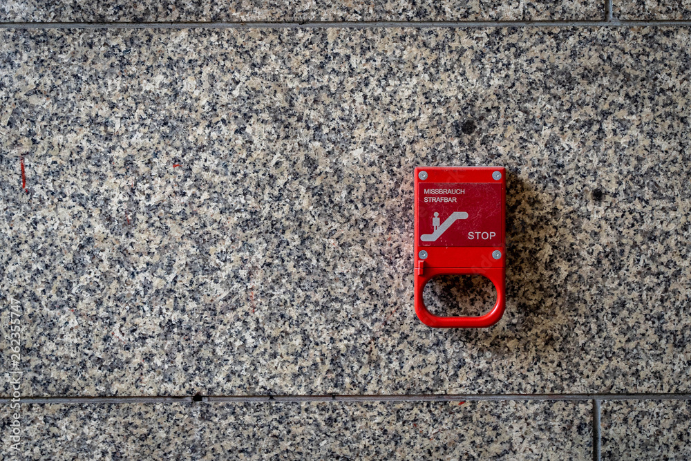 Red stop switch for emergency stop on an escalator in Germany, saying ...