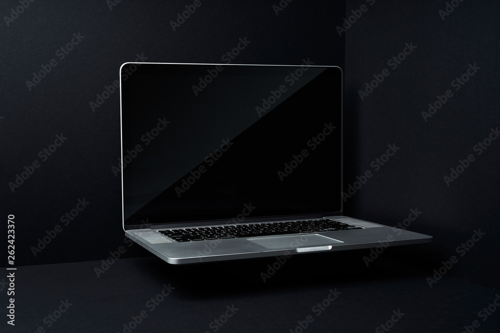 Laptop floating on mockup three dimensional black background Stock ...