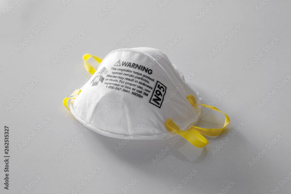 N95 air filter mask. personal protective equipment on white table with ...