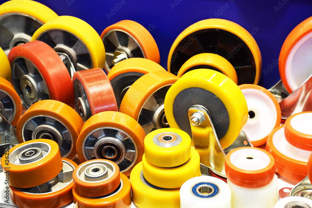 Group of different size and diameter industrial small wheels in warm ...