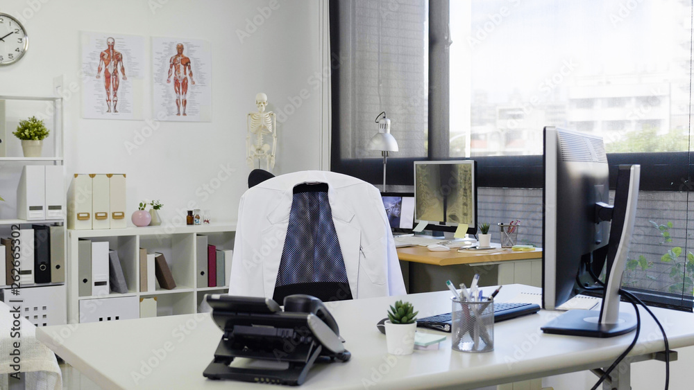 bright and modern medical doctor office complete with personal computer ...