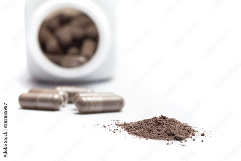 Herbal medicine in capsule isolate on white background. Herb black ...