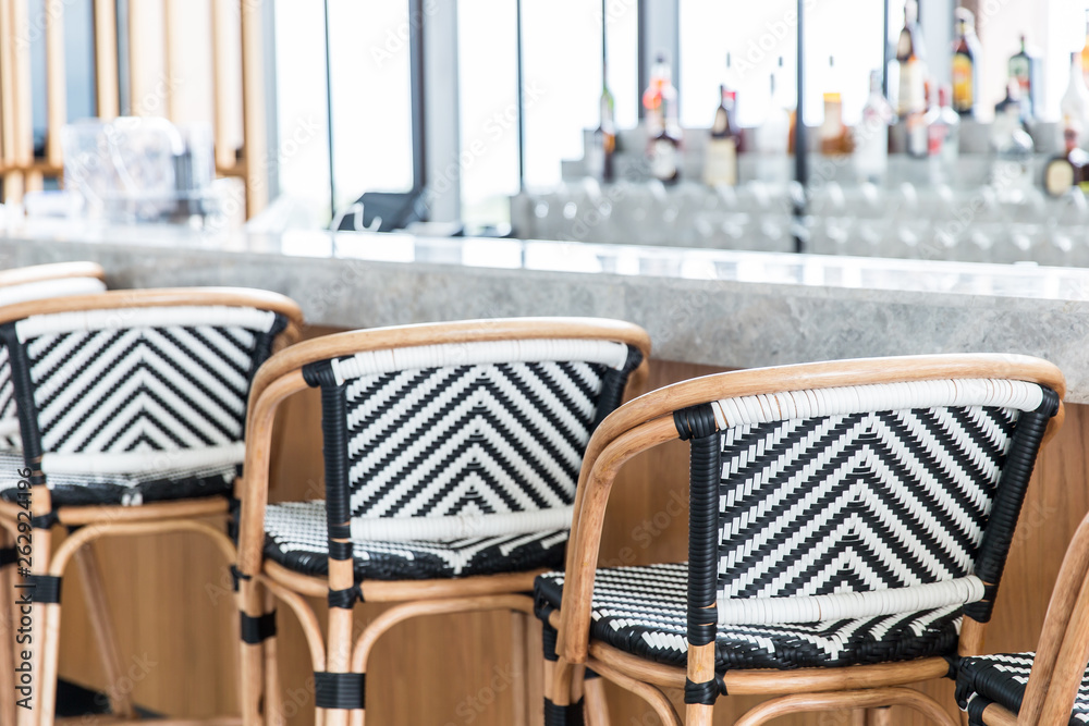 bar stools assemble in a beautiful diagonal row against the ba Stock ...