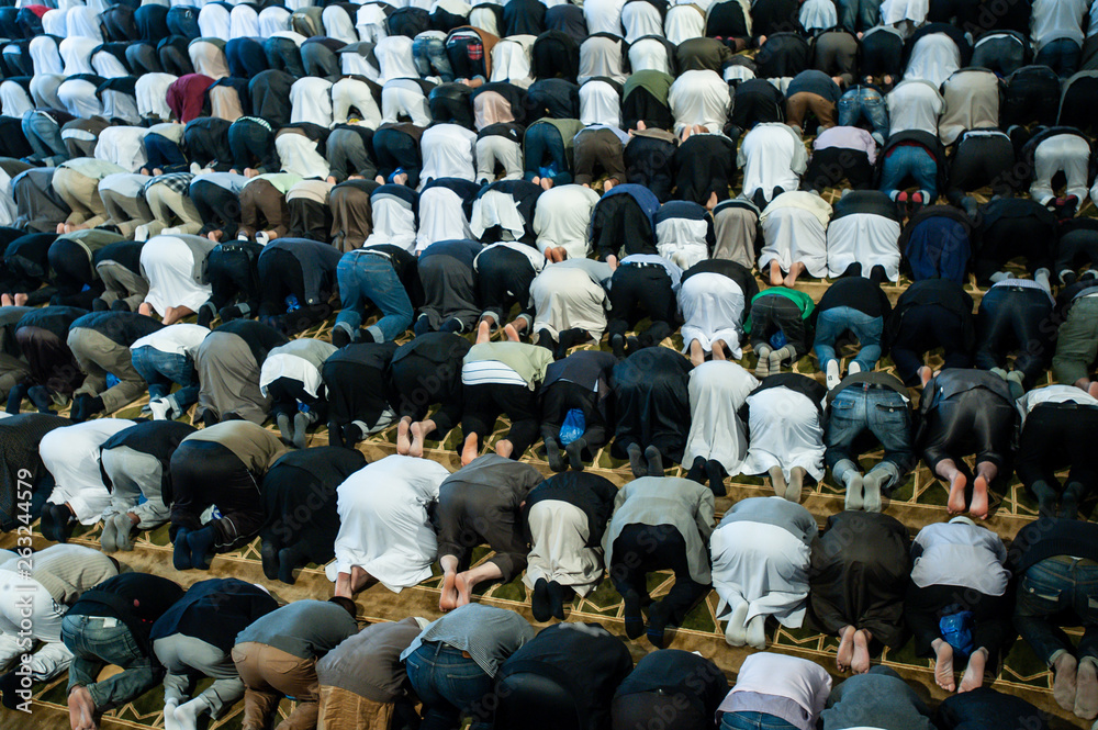 Muslim prayer. A group of Muslim men pray inside a Mosque. Islam ...