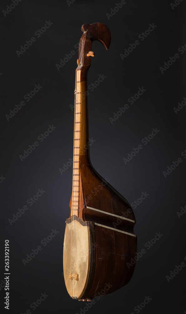 ancient Asian stringed musical instrument on black background with ...
