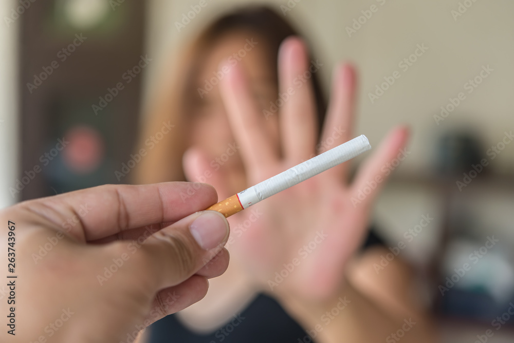 Asian woman make hand Refuse cigarette.Quitting from addiction concept ...