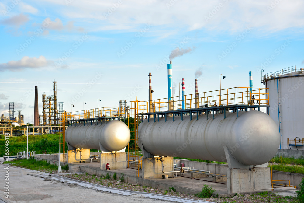 Refinery storage tanks and containers of ethanol under the blue sky ...