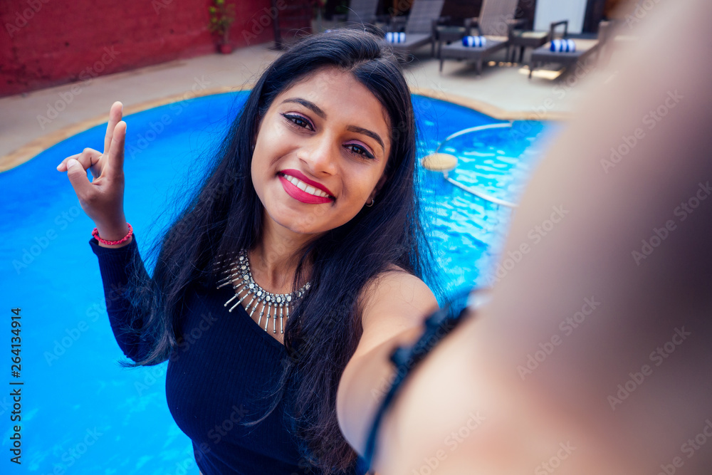 beautiful indian woman toothy white smile selfie portrait on smartphone ...