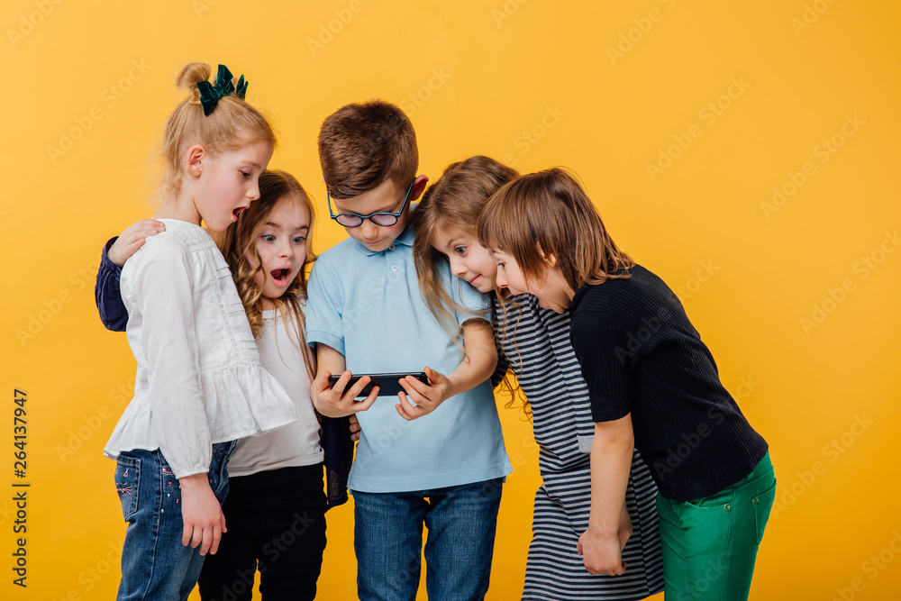 group of children, small boys and little girls, are scared watching the ...