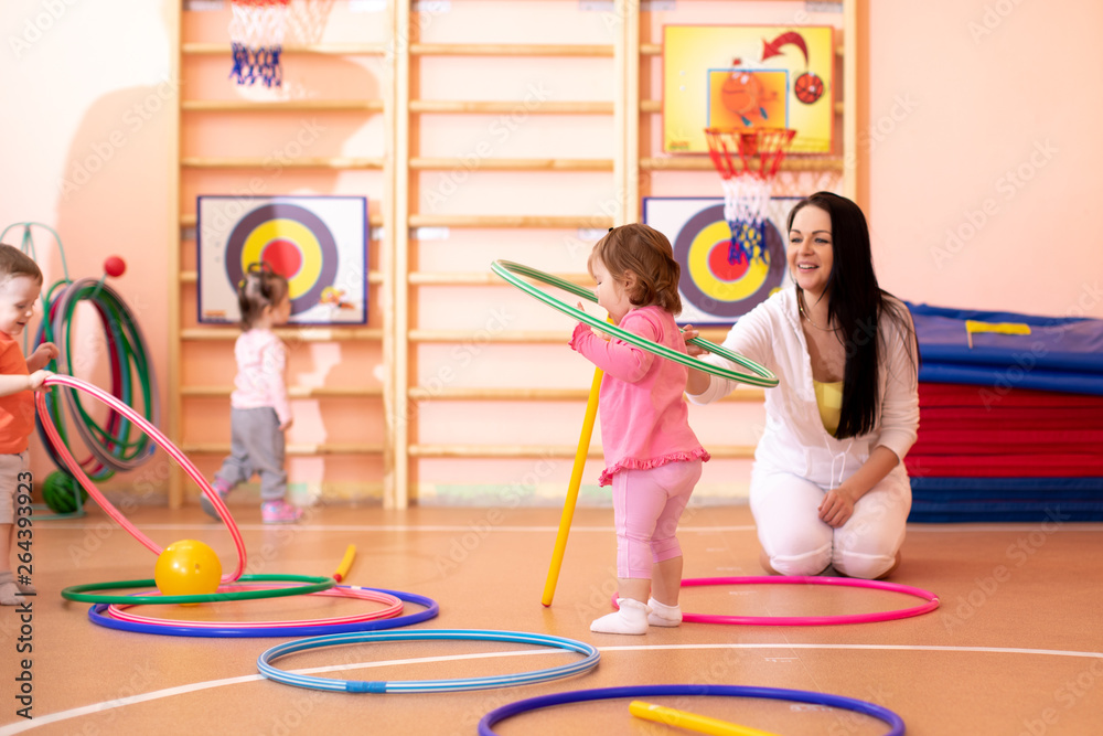 Kids group with colorful hula hoops Stock Photo | Adobe Stock