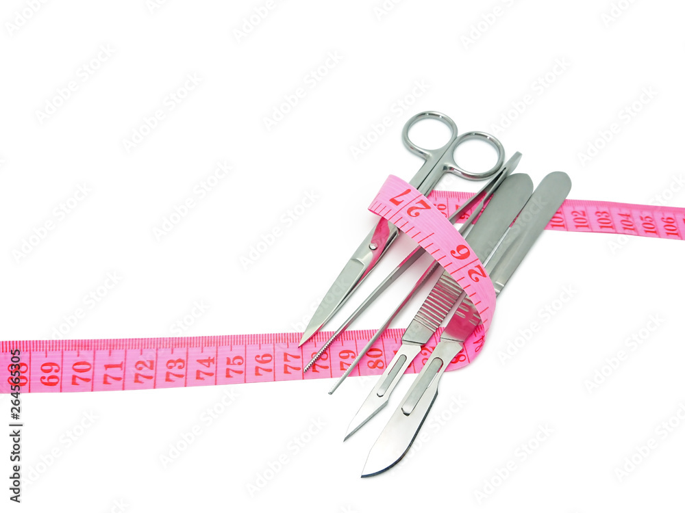 Surgical instrument set with pink weight tape scale isolated on white ...