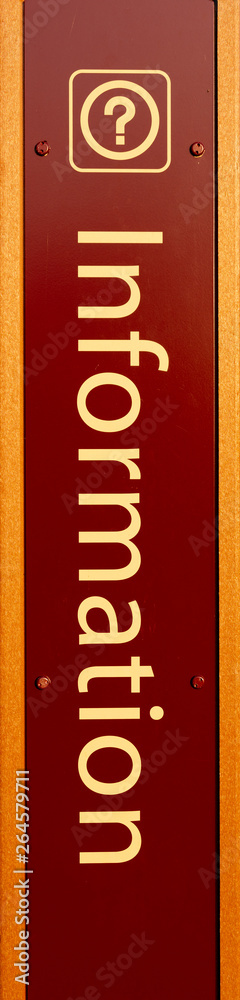 Information sign with symbol and text shown vertically with yellow on ...