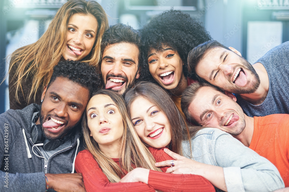 International group of young friends taking selfie with funny faces ...