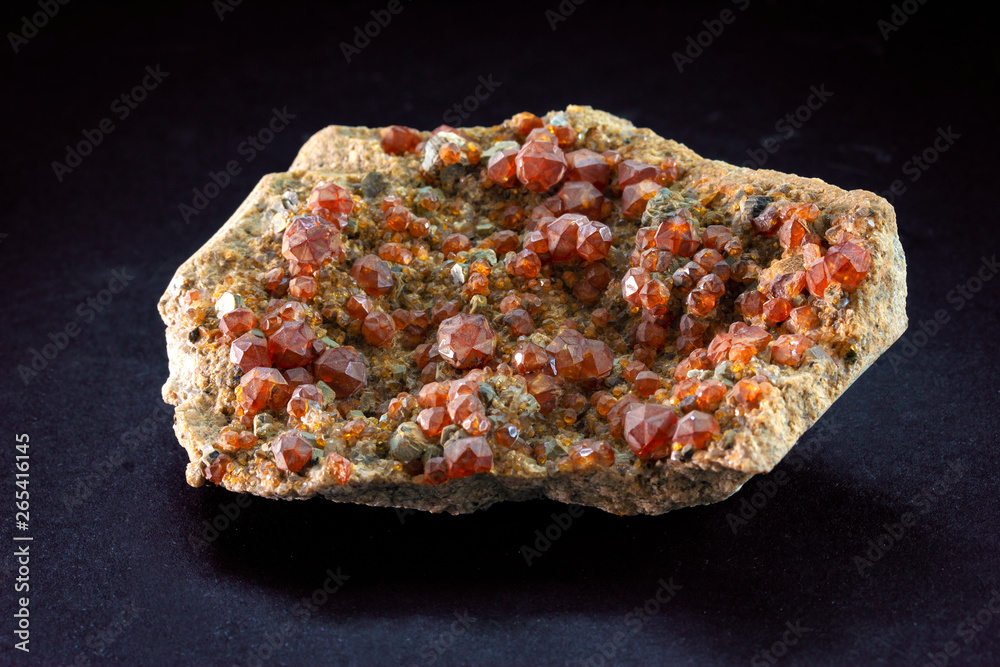 Cluster of Garnet Almandine crystals from Italy. Garnets are a group of ...