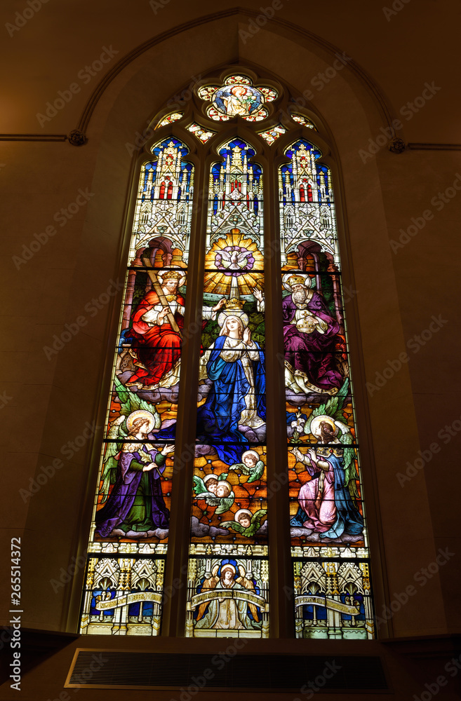 Foto de Stock Renovated stained glass window of Mary crowned Queen of ...